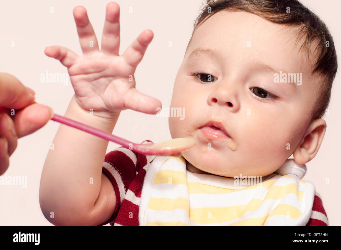 Child grabbing spoon hi-res stock photography and images - Alamy