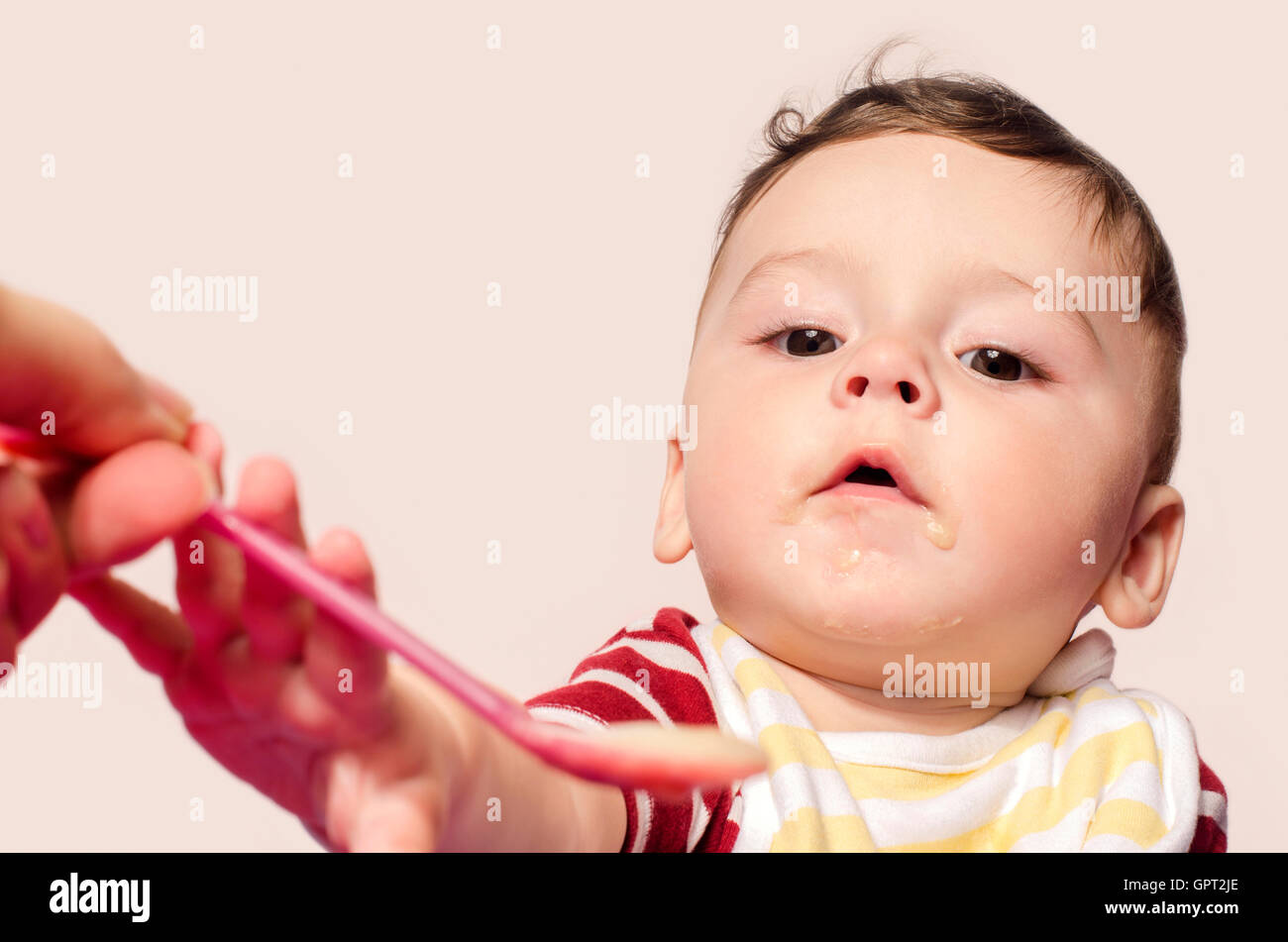 Child grabbing spoon hi-res stock photography and images - Alamy