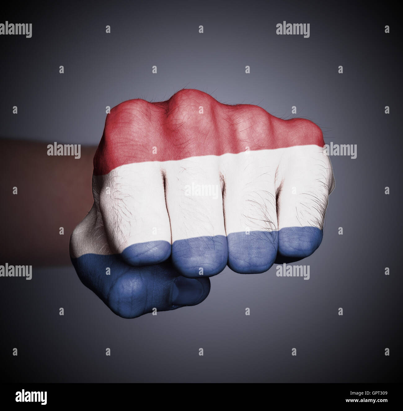 Front view of punching fist on gray background Stock Photo - Alamy