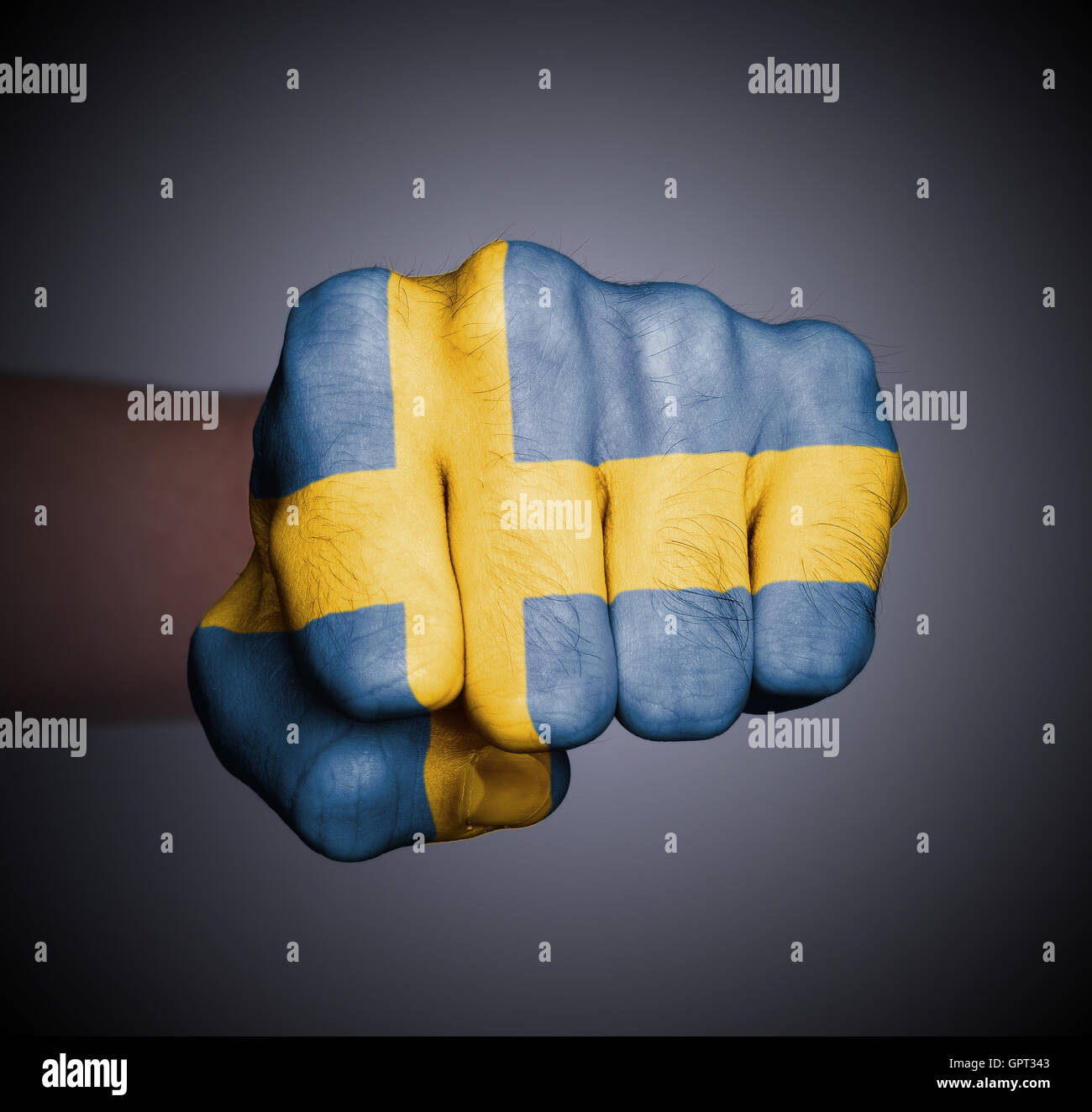 Front view of punching fist on gray background Stock Photo - Alamy