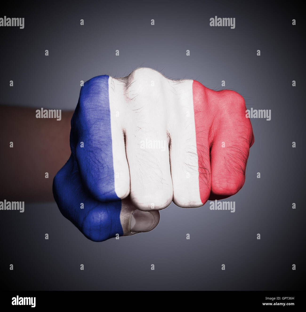 Front view of punching fist on gray background Stock Photo - Alamy