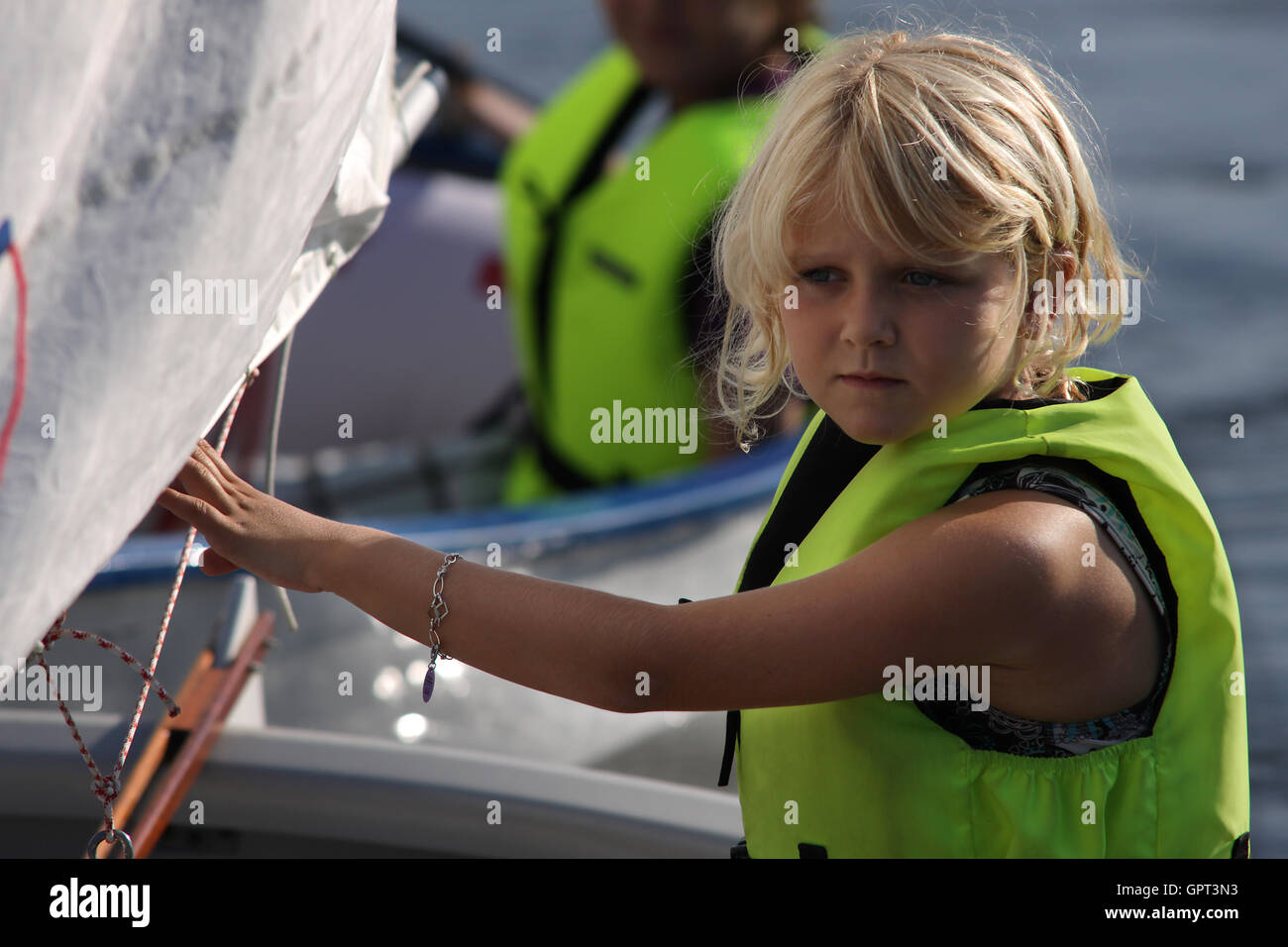 Young girl sailing Stock Photo - Alamy
