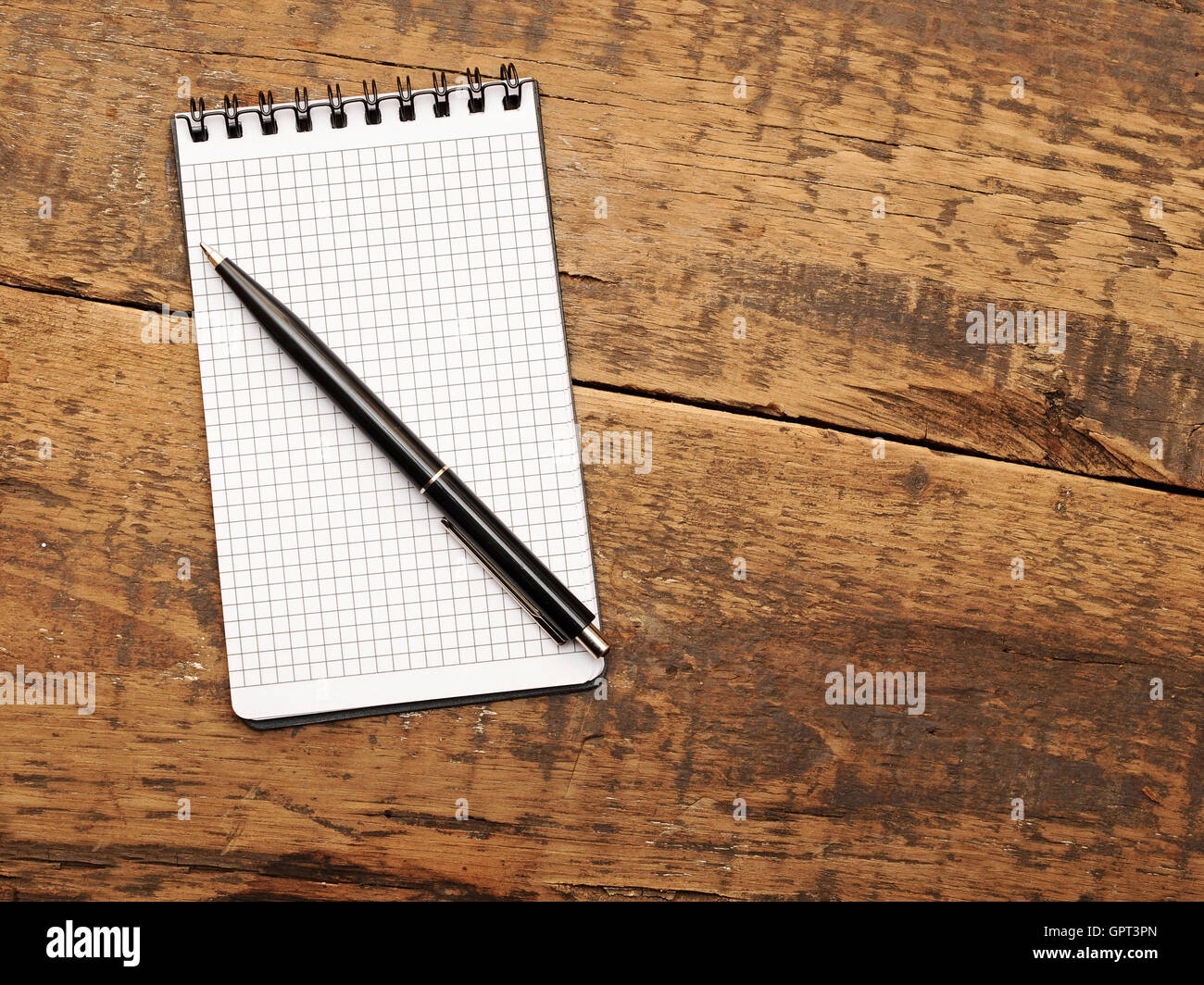 Blank notepad with pen on wood table Stock Photo - Alamy