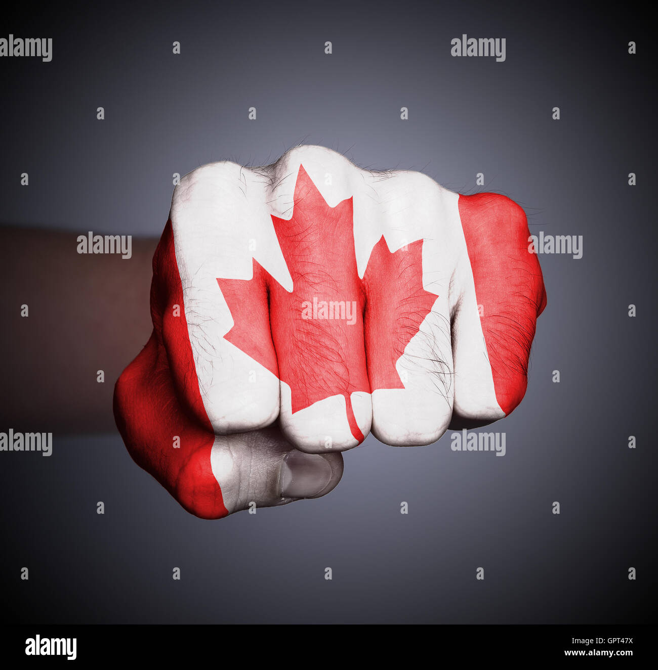 Front view of punching fist on gray background Stock Photo - Alamy