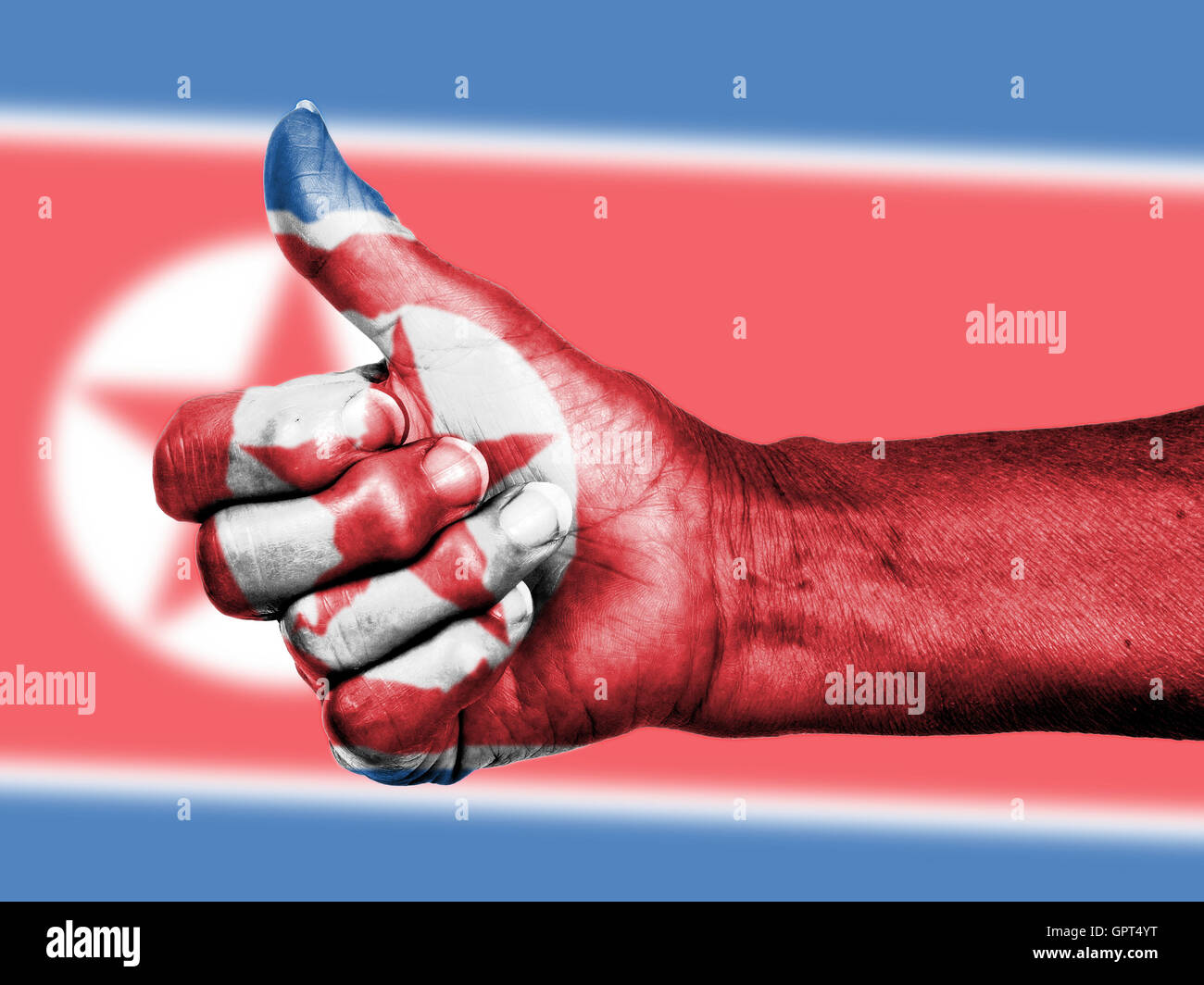 North Korean flag on thumbs up hand Stock Photo - Alamy