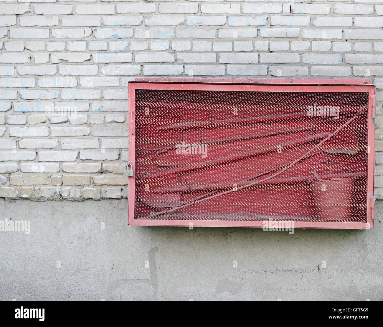 Fire fighting equipment on brick wall Stock Photo - Alamy