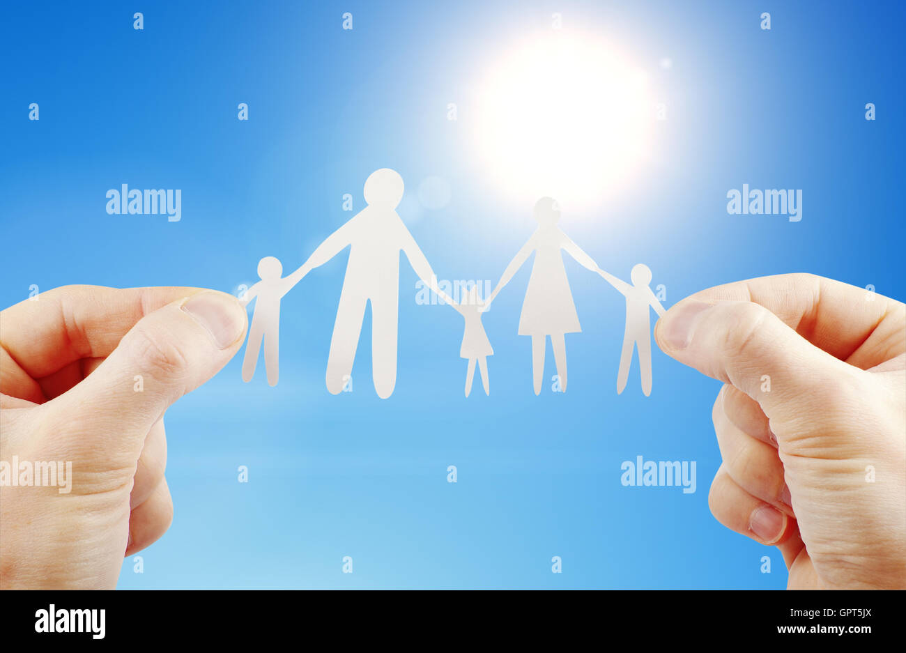 paper family in hands Stock Photo - Alamy