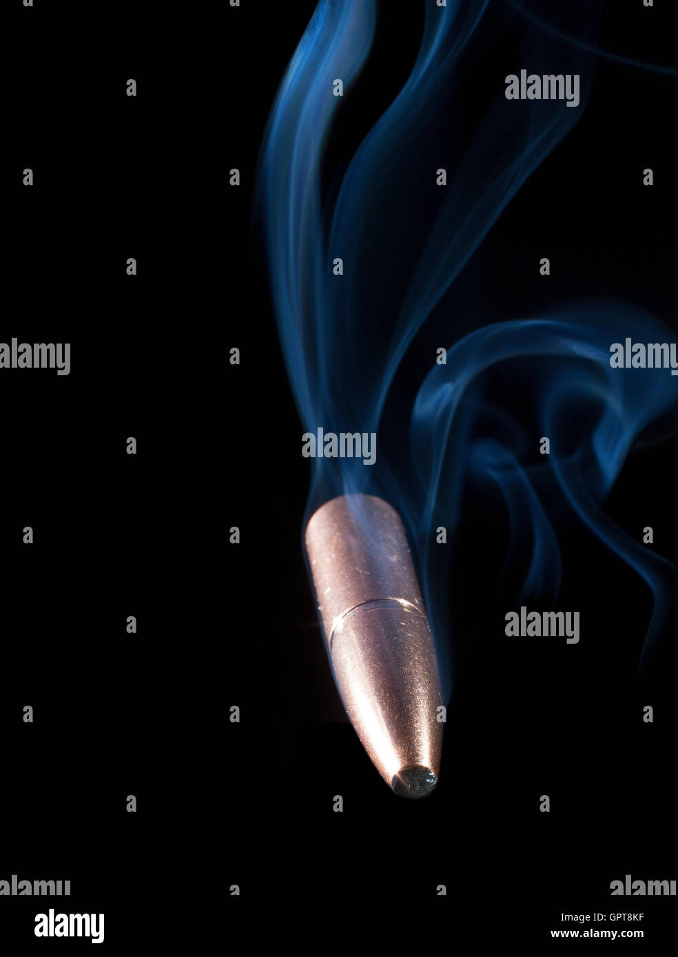 Copper bullet with smoke behind that looks like it is moving Stock ...