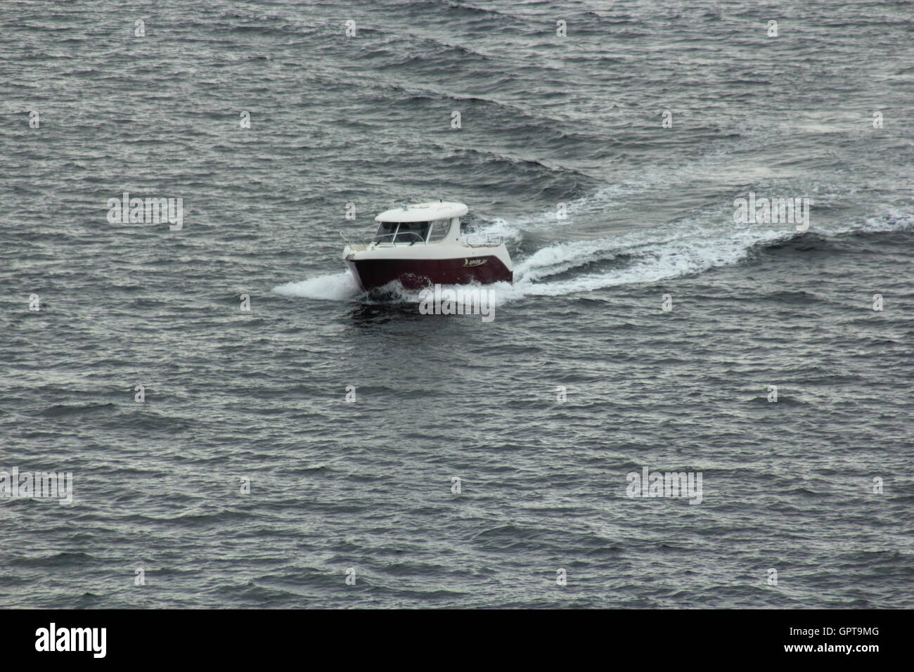 Small boat in the ocean Stock Photo - Alamy