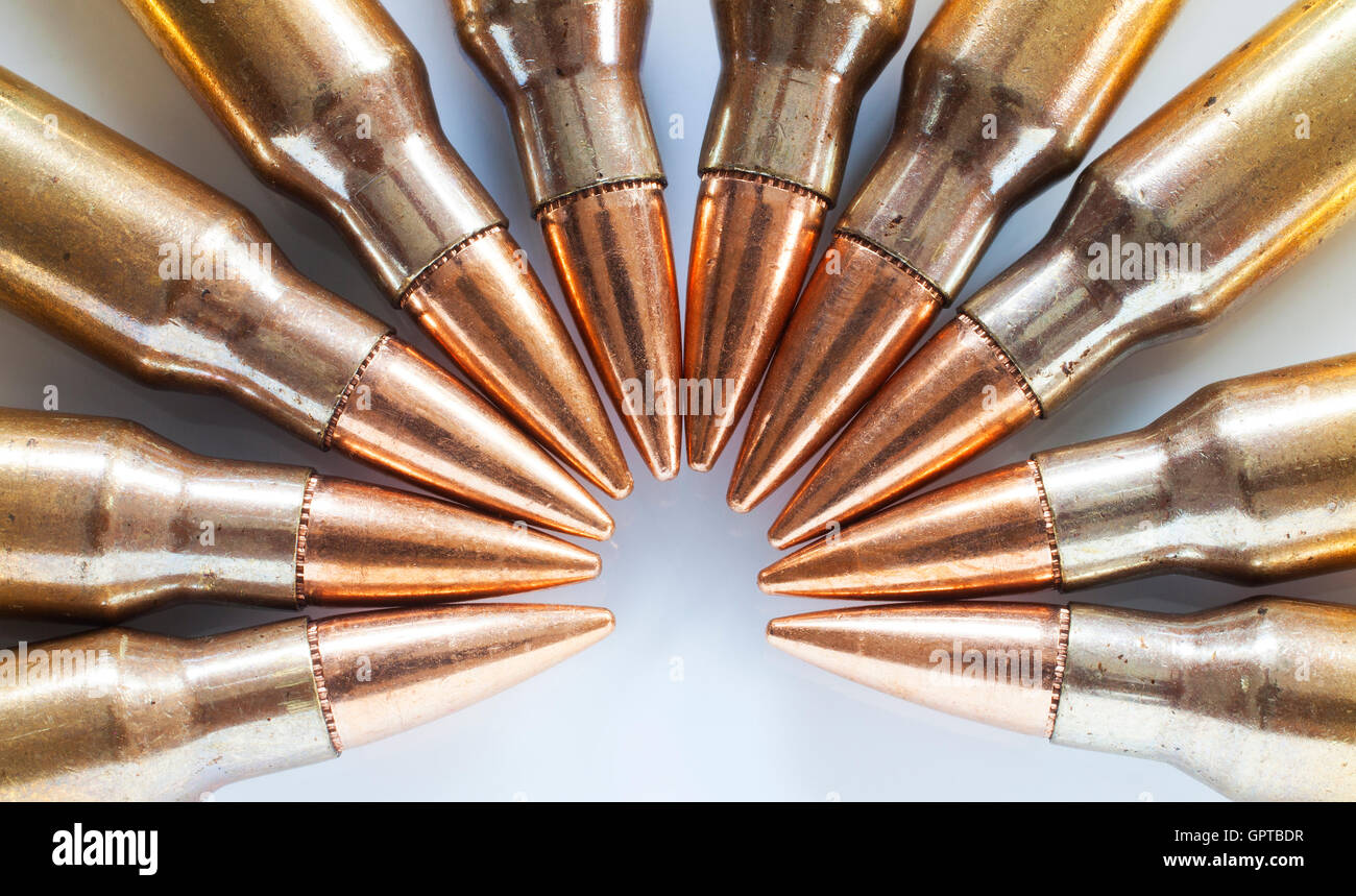 Bullets with a steel core loaded on rifle cartridges with a white ...