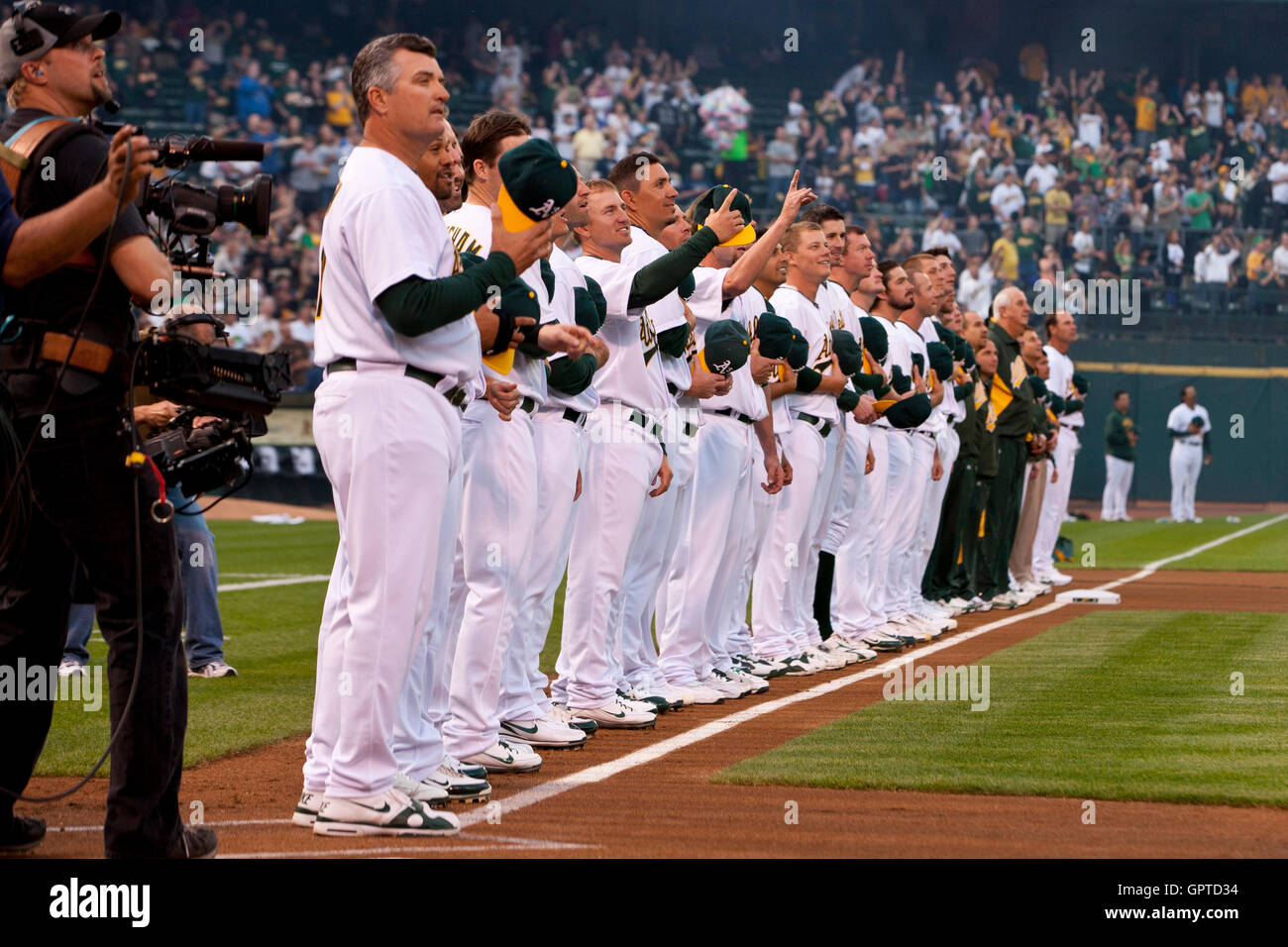 April 1, 2011; Oakland, CA, USA; The Oakland Athletics watch as two F ...