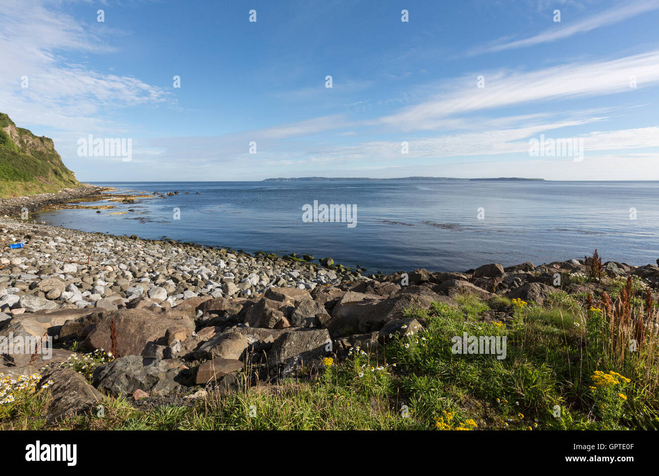 Ballycastle pebble beach overlooking Rathlin Island , County Antrim ...