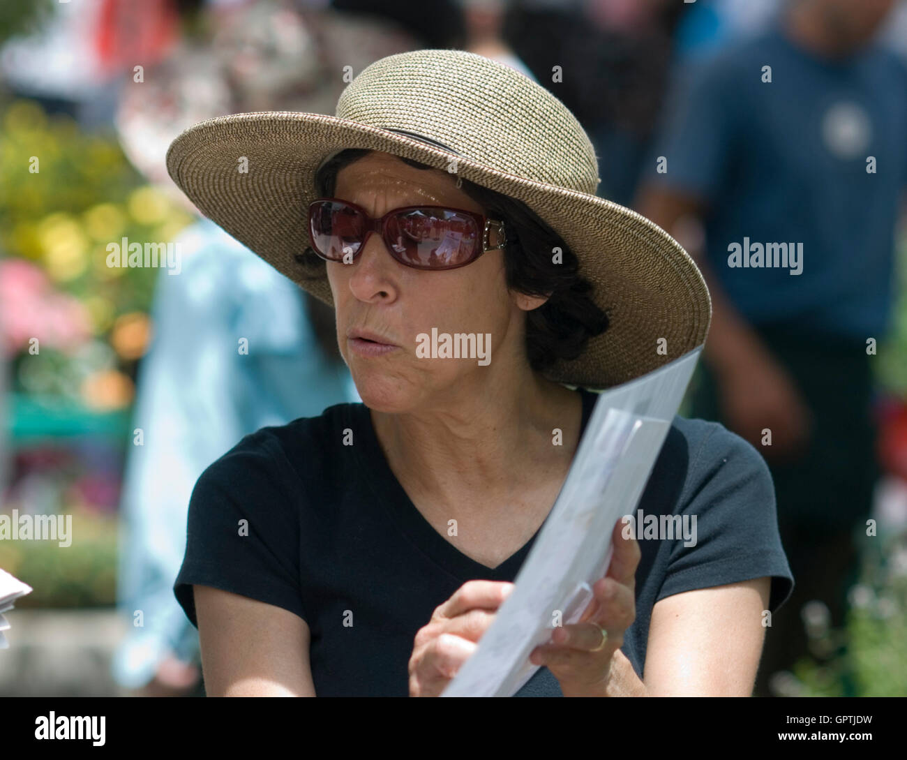 Woman selling newspaper subscriptions Stock Photo - Alamy