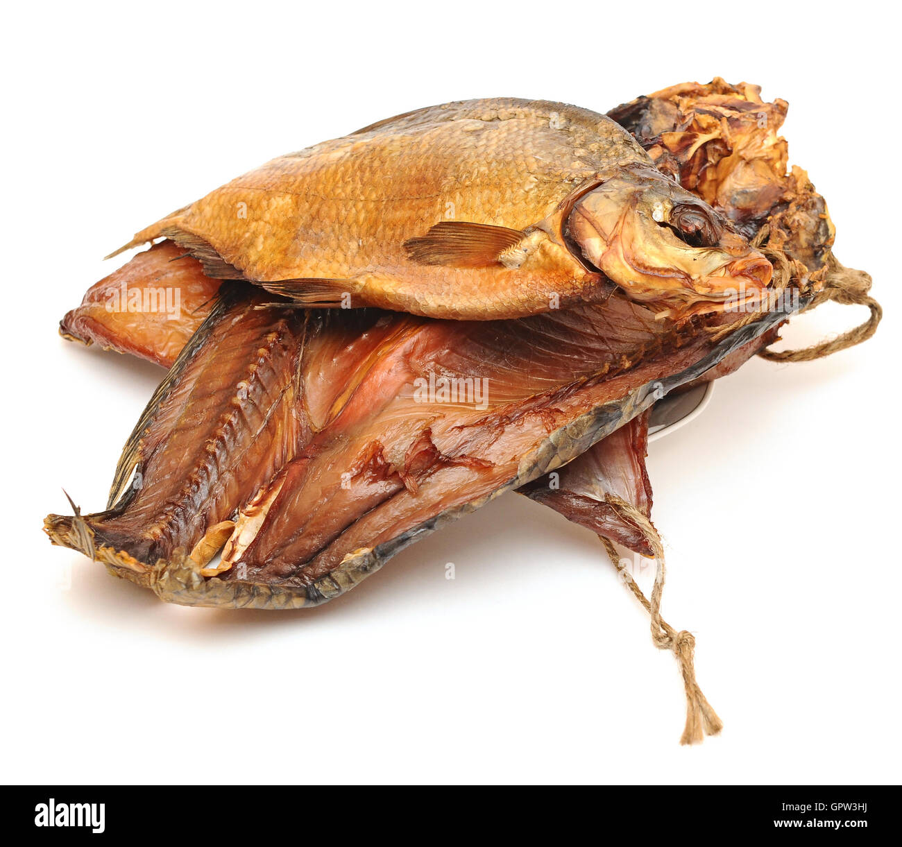 pile smoked fish on a white background Stock Photo - Alamy