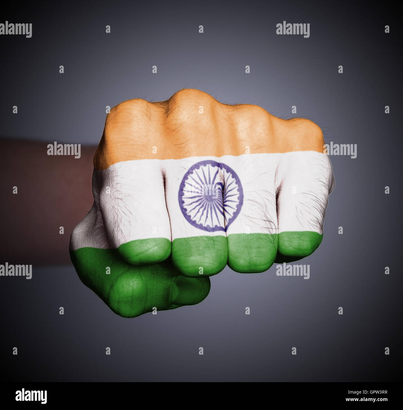 Front view of punching fist on gray background Stock Photo - Alamy