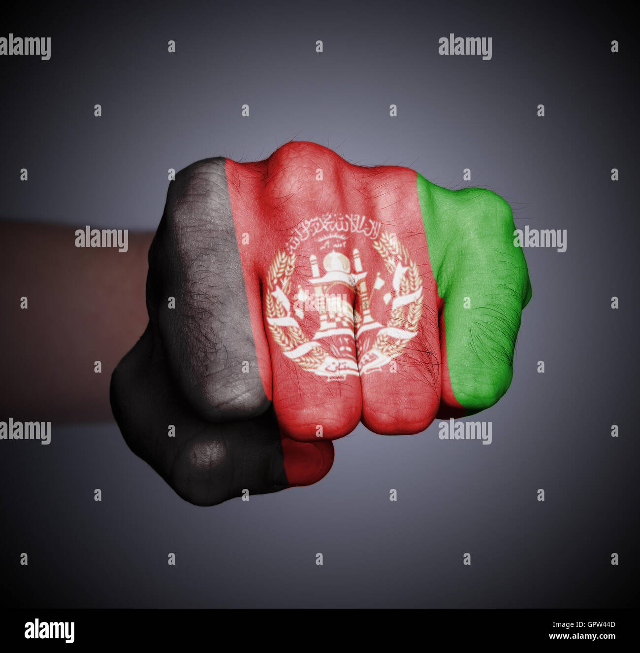 Front view of punching fist on gray background Stock Photo - Alamy