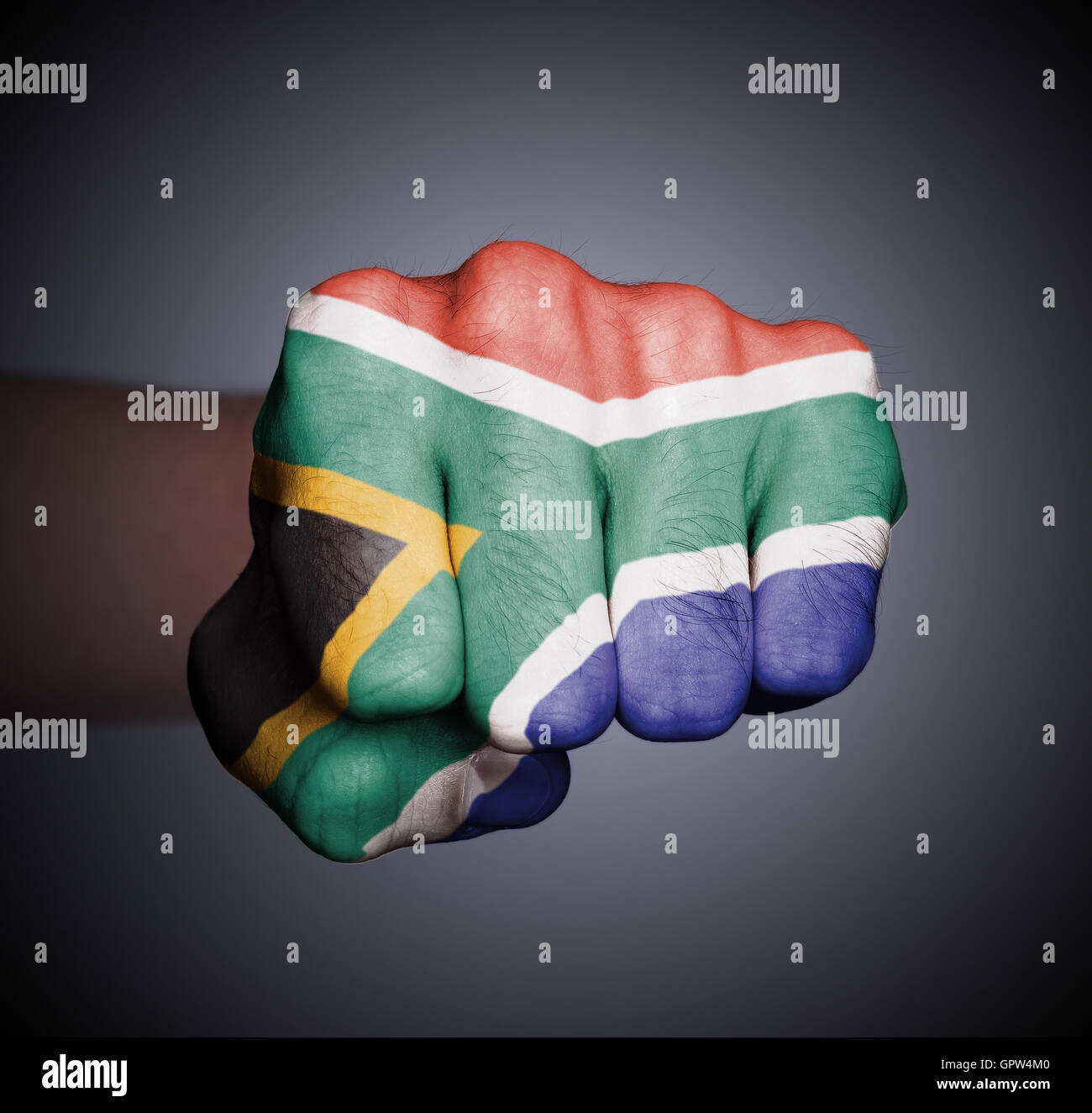 Front view of punching fist on gray background Stock Photo - Alamy