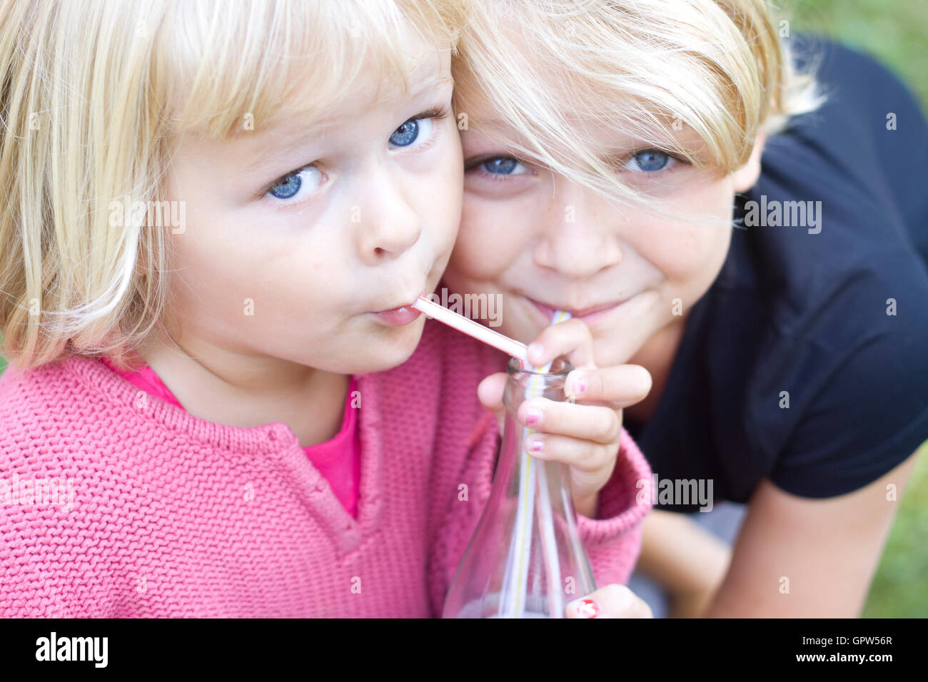 Girls blond glass juice hi-res stock photography and images - Alamy