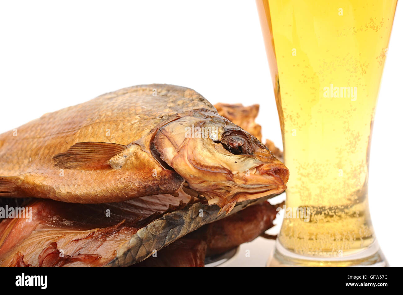 Smoked fish and cup of beer on a white background Stock Photo - Alamy