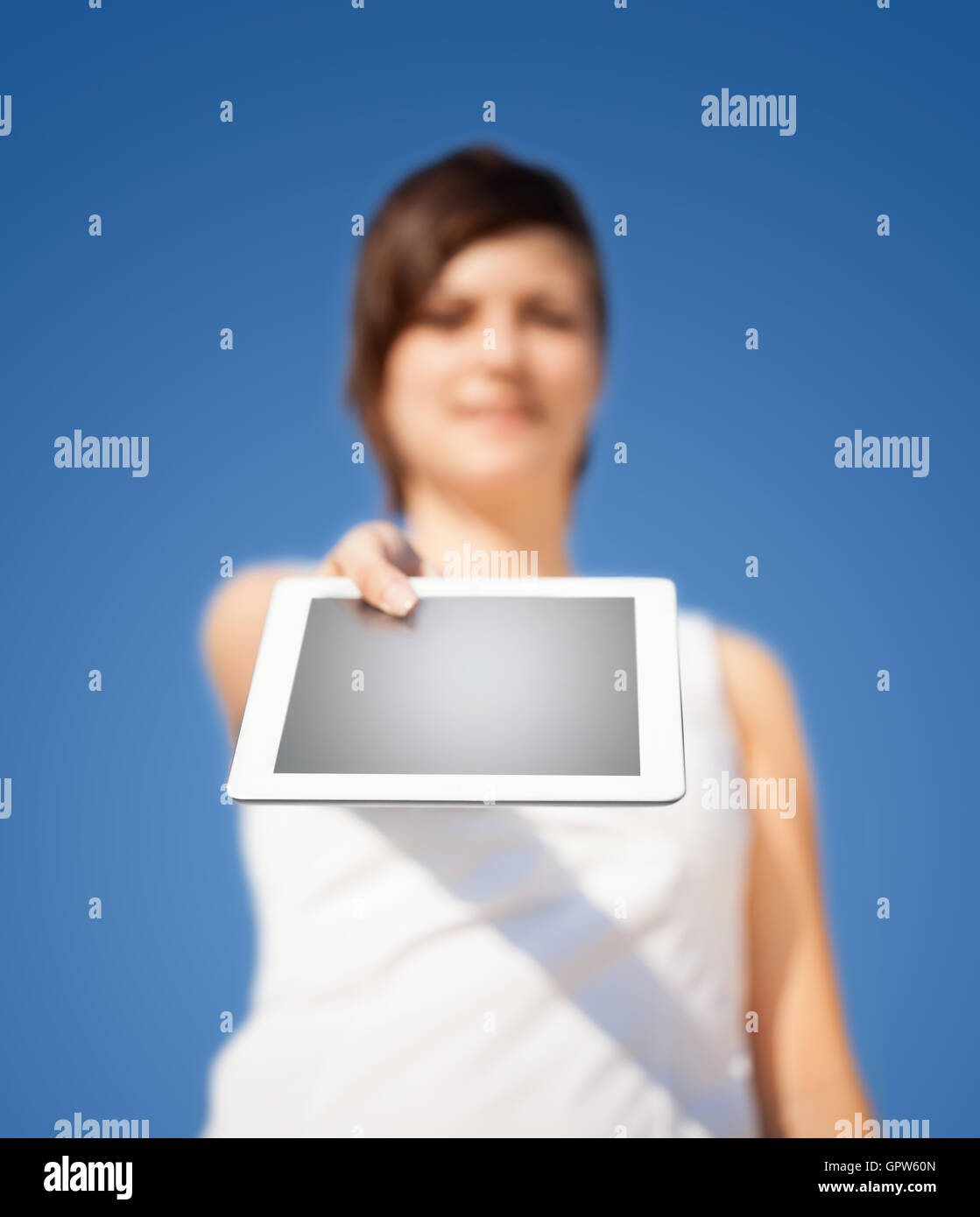 Young woman looking at modern tablet Stock Photo - Alamy