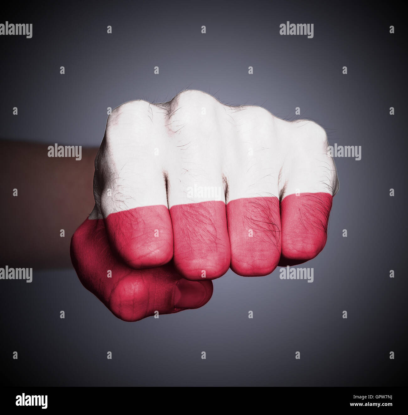 Front view of punching fist on gray background Stock Photo - Alamy