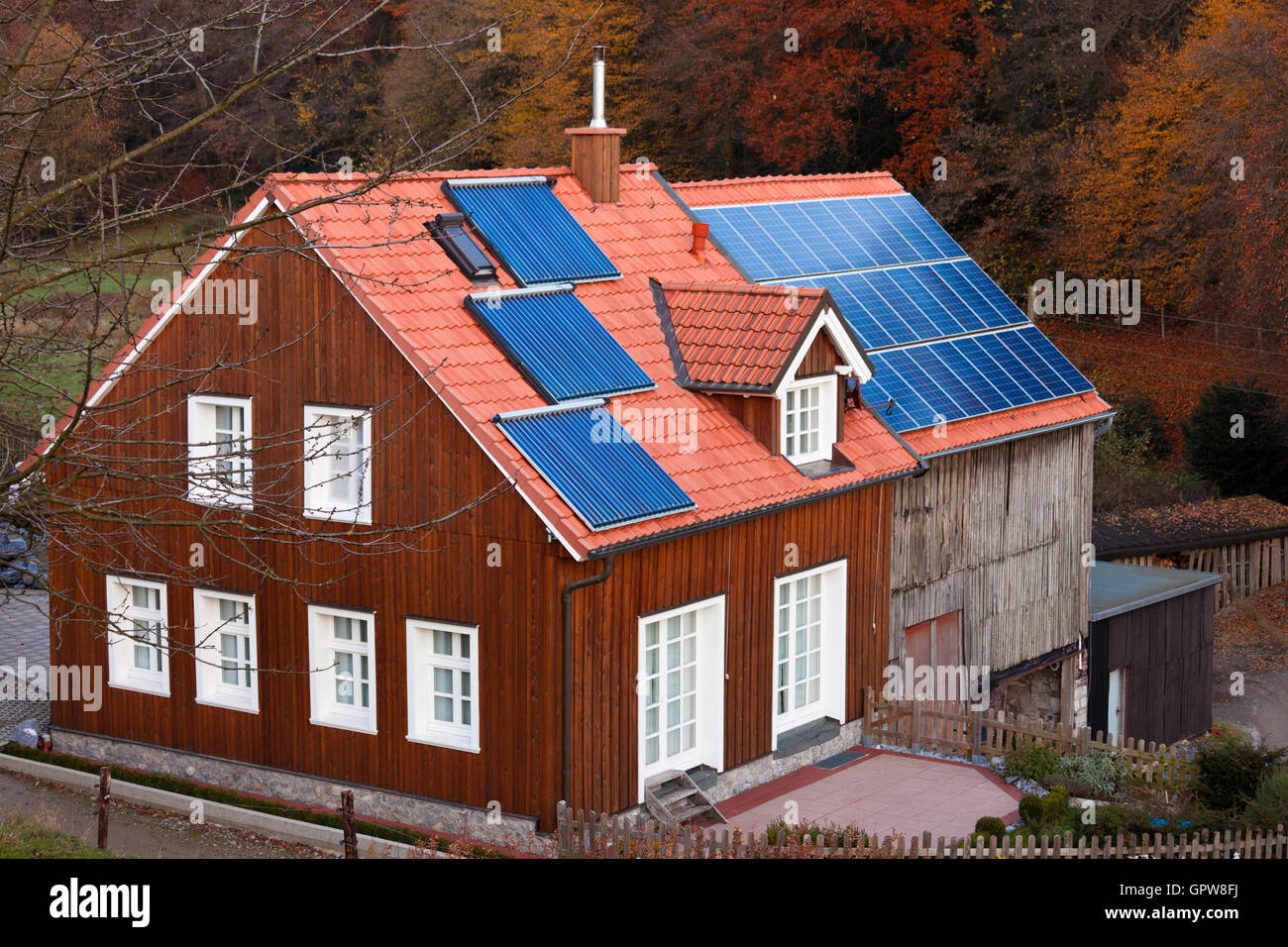 House with solar panels sun heating system on roof Stock Photo - Alamy