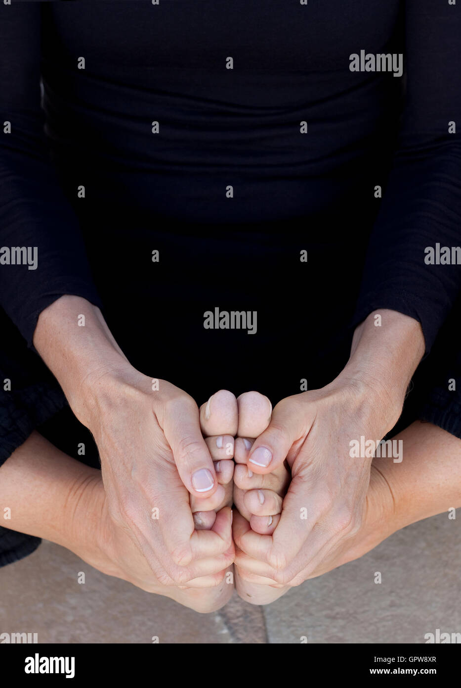 Hands and feet Stock Photo - Alamy