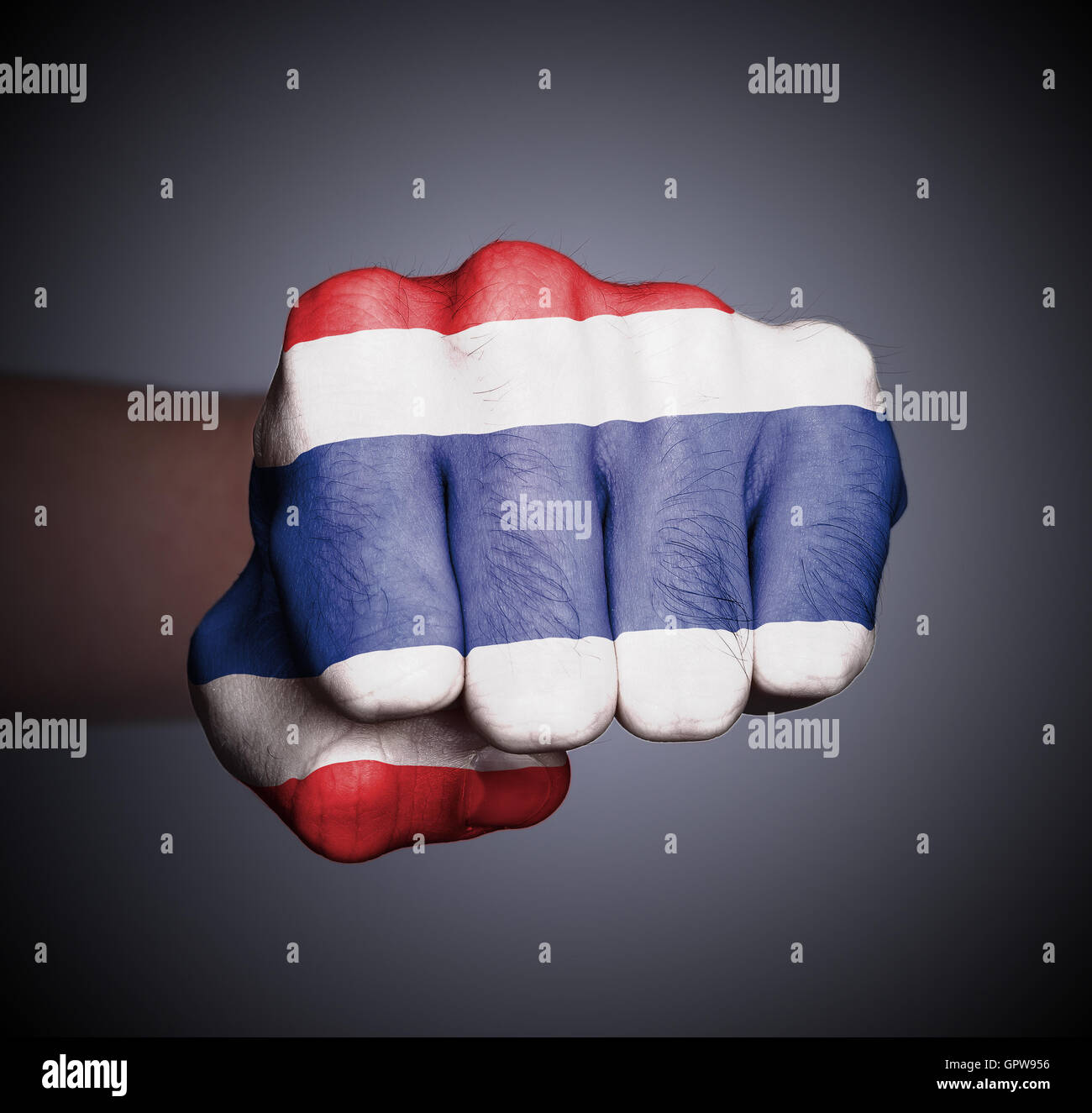 Front view of punching fist on gray background Stock Photo - Alamy