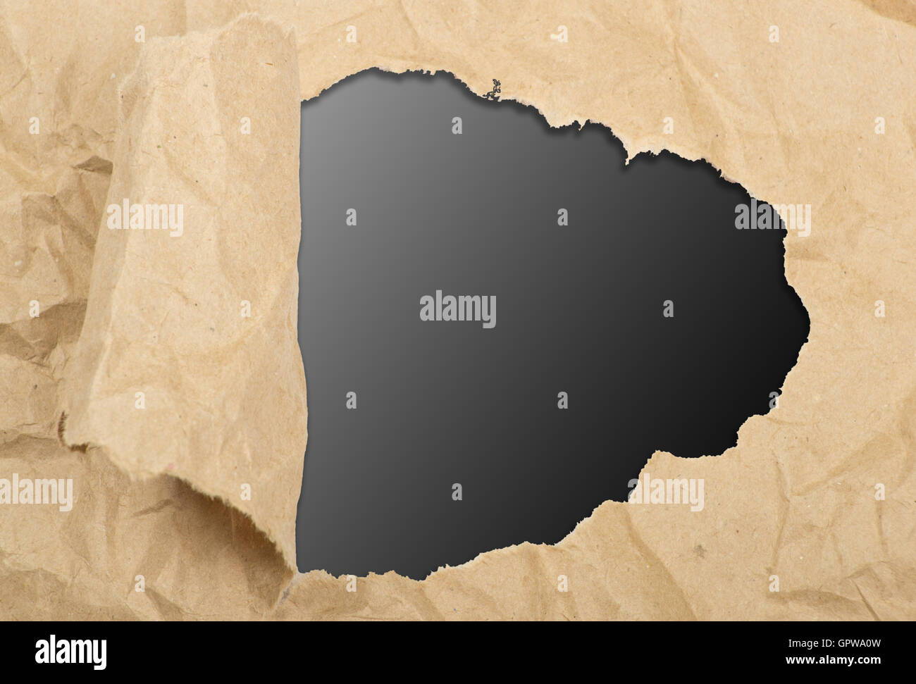 ripped white paper against a black background Stock Photo - Alamy