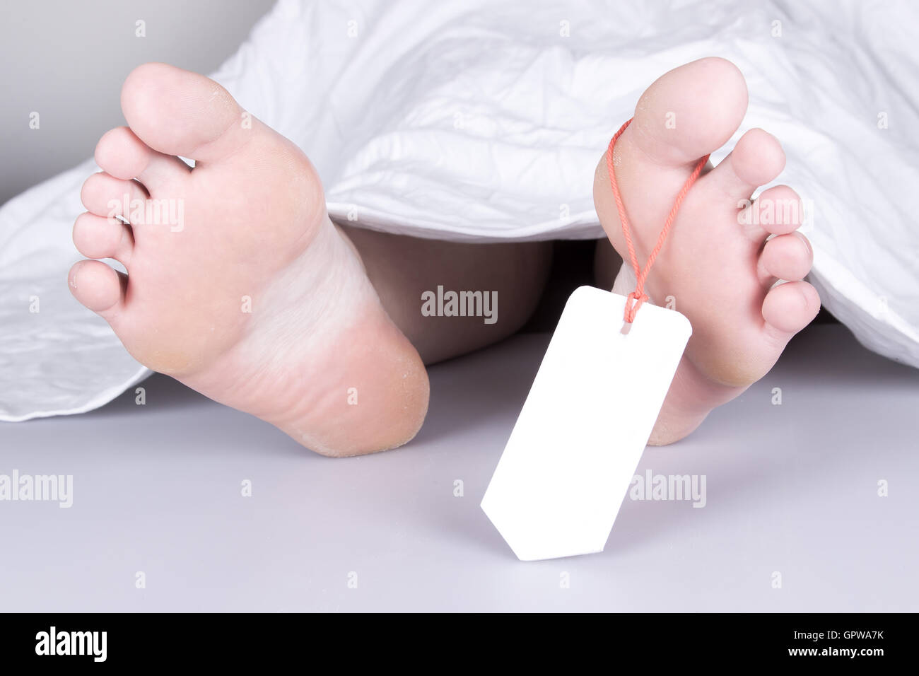 Dead body with toe tag Stock Photo - Alamy