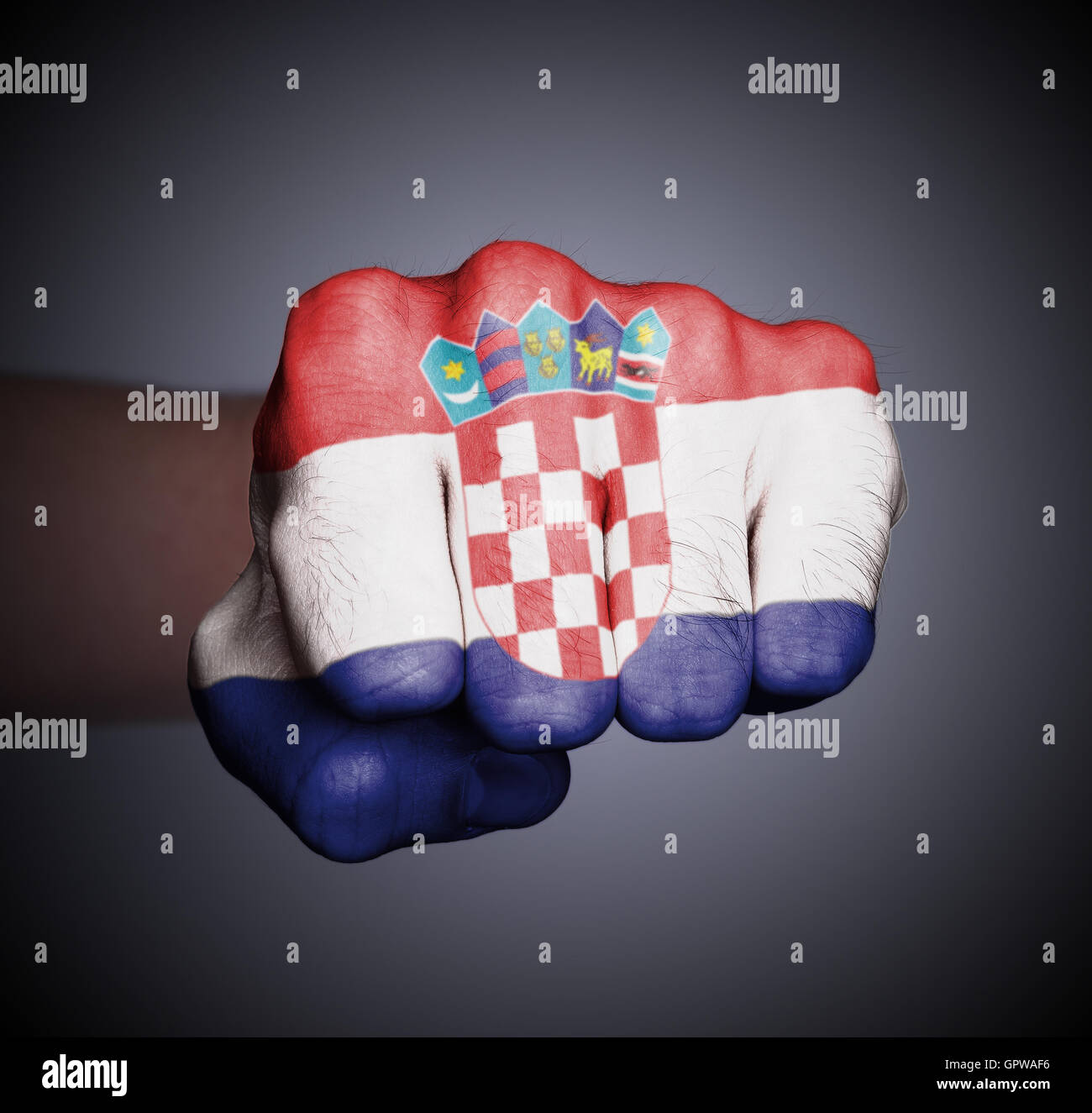 Front view of punching fist on gray background Stock Photo - Alamy