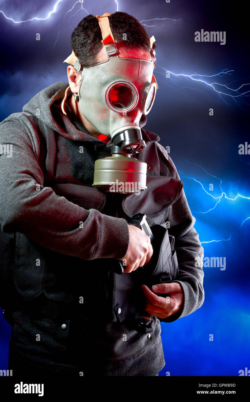 Man with long leather jacket and assault rifle over storm backgr Stock ...