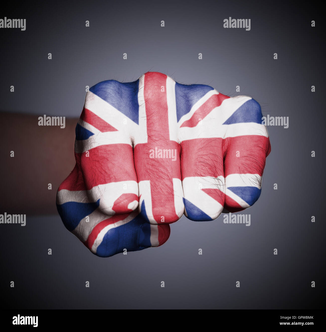 Front view of punching fist on gray background Stock Photo - Alamy