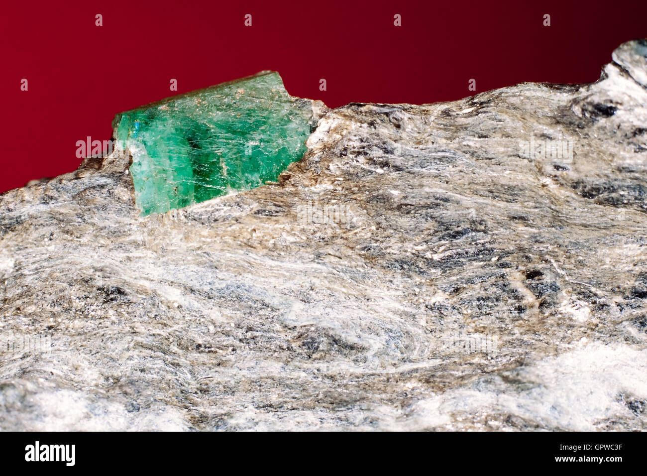 Rare emerald raw precious gemstone on matrix rock Stock Photo - Alamy