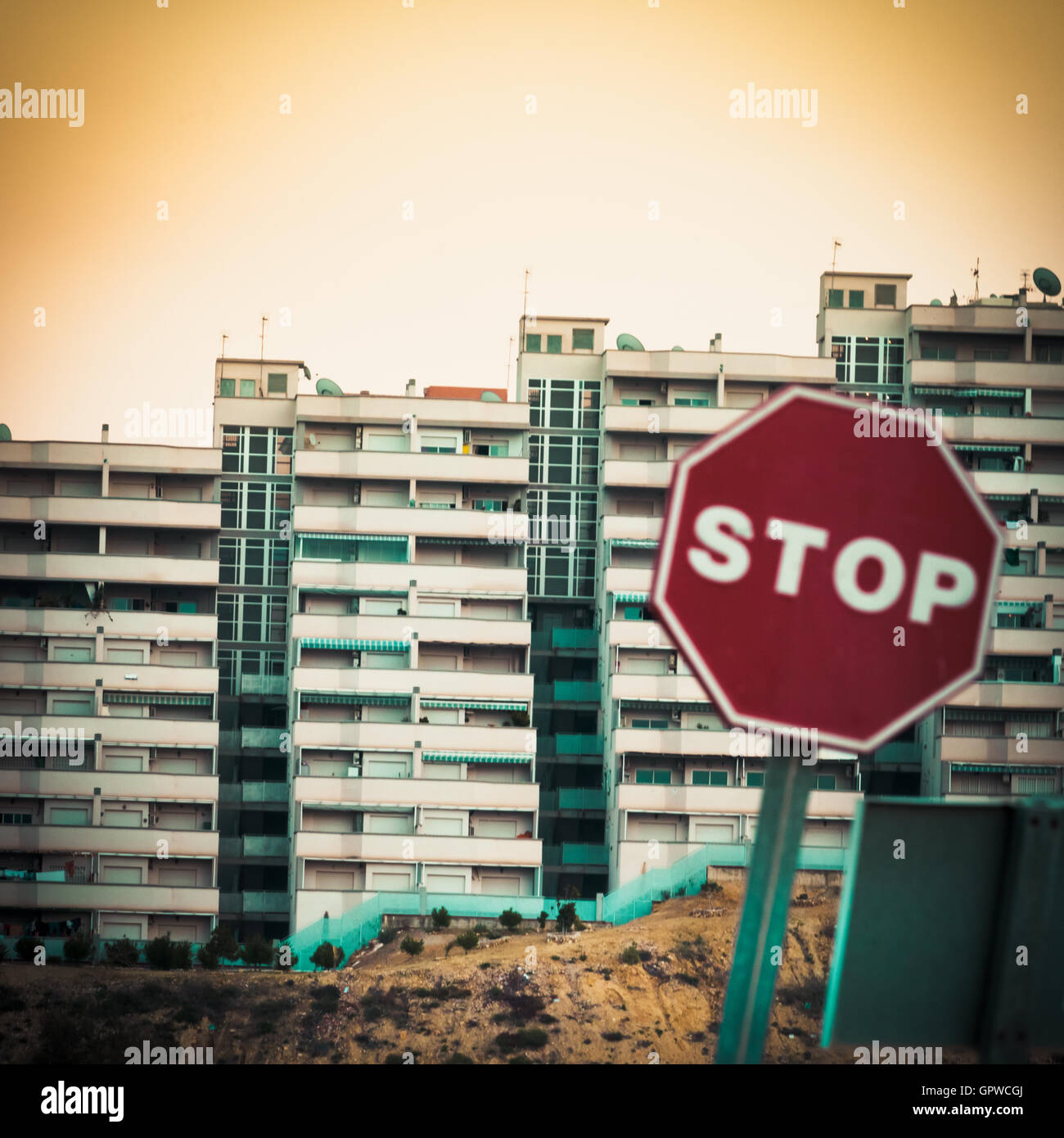 Mobile photography toned stop sign and condo units Stock Photo - Alamy