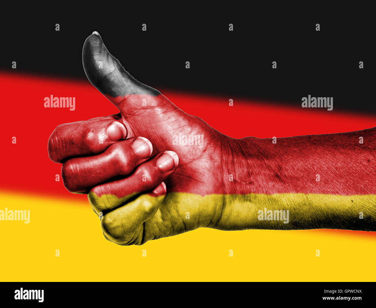 German flag on thumbs up hand Stock Photo - Alamy