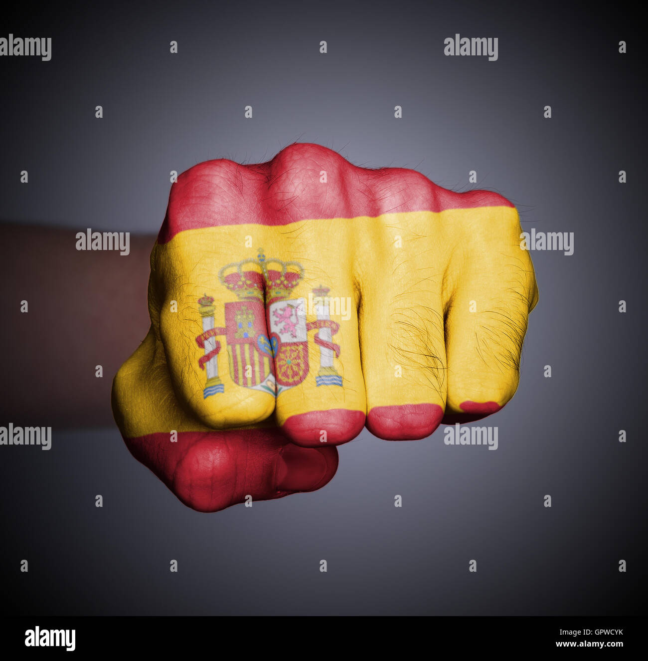 Front view of punching fist on gray background Stock Photo - Alamy