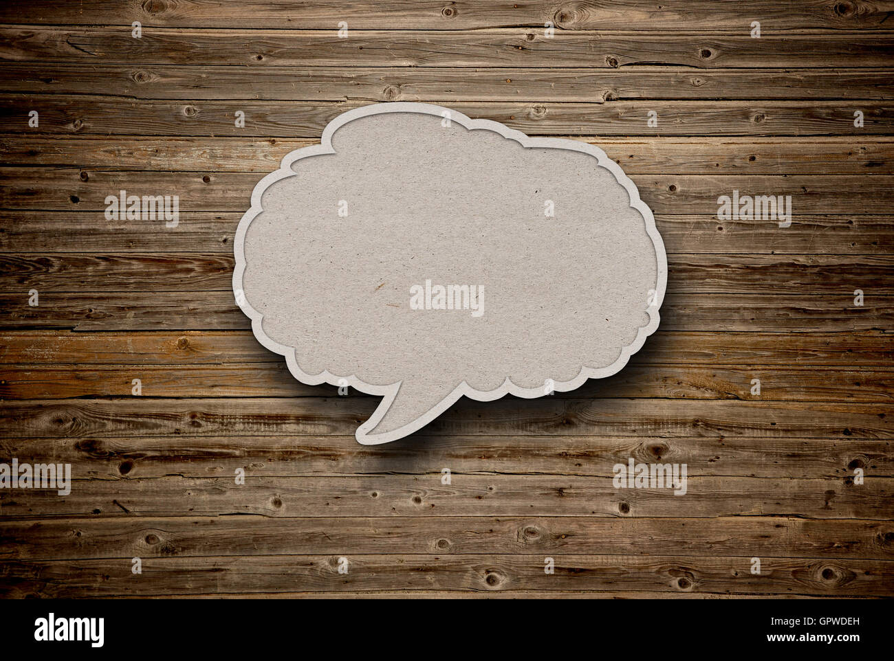 blank recycled paper speech bubble on wood background Stock Photo - Alamy