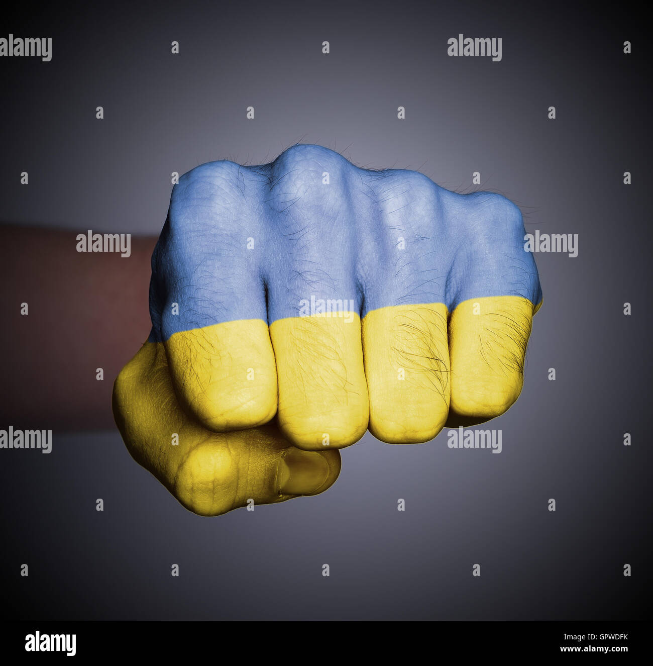 Front view of punching fist on gray background Stock Photo - Alamy