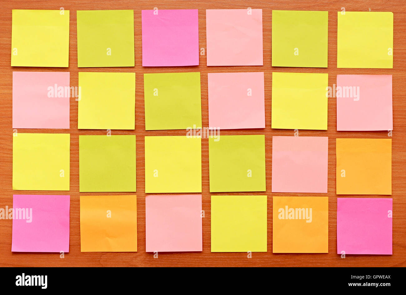 colorful notes on a wooden background Stock Photo - Alamy