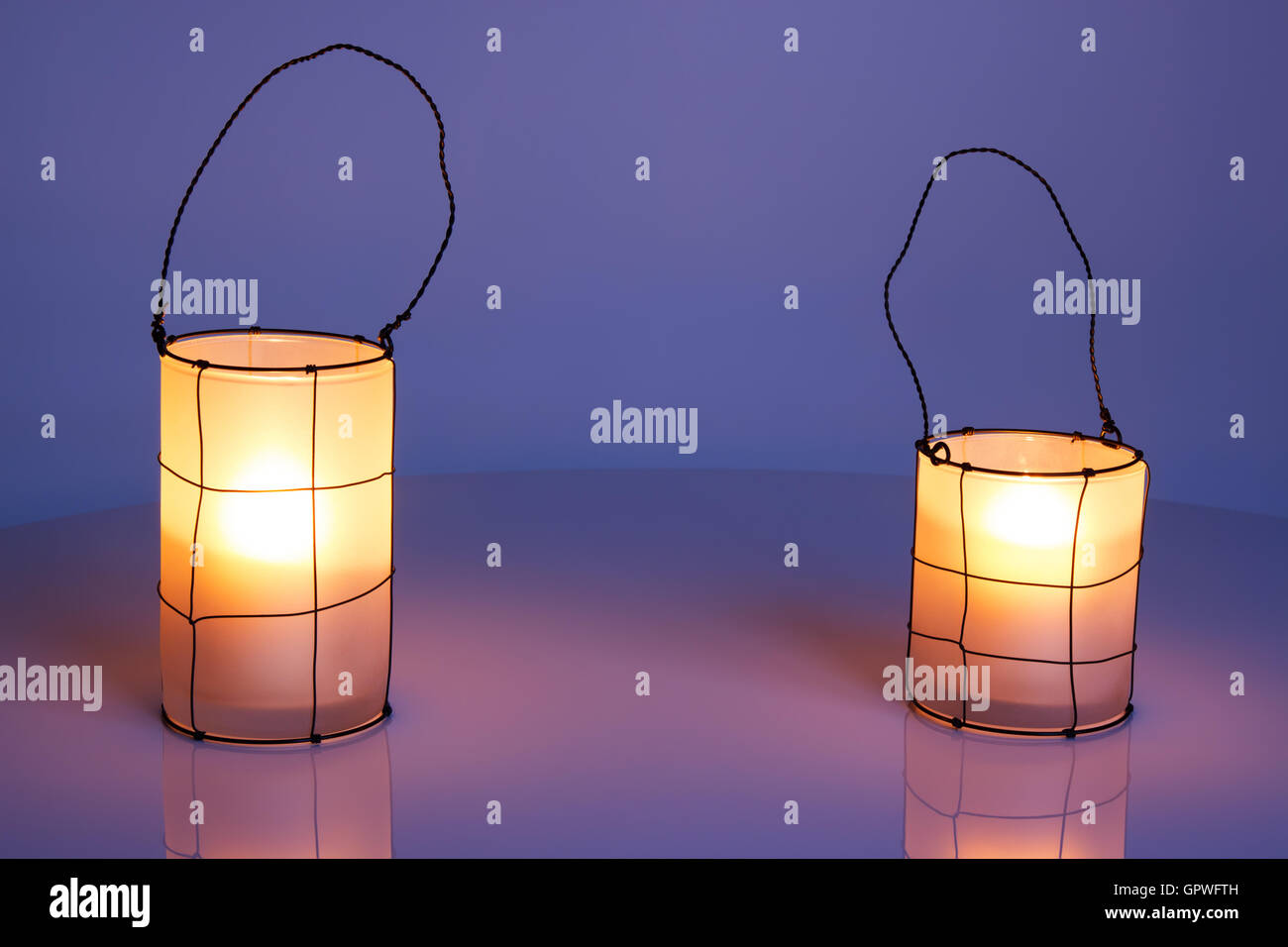 Two cozy lanterns in twilight Stock Photo - Alamy