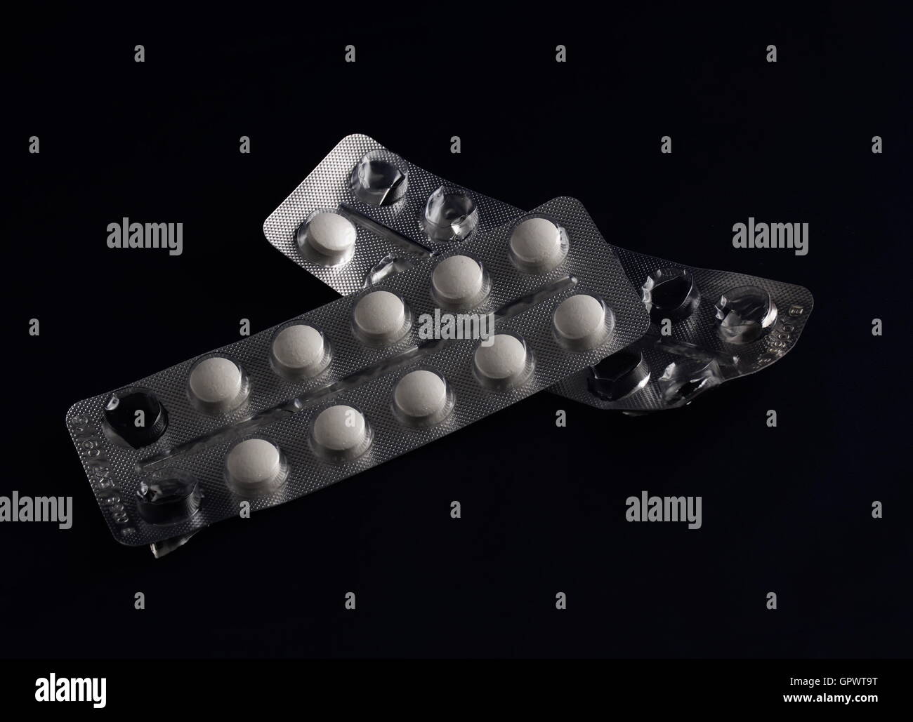 Used packs of tablets isolated with a black background Stock Photo - Alamy