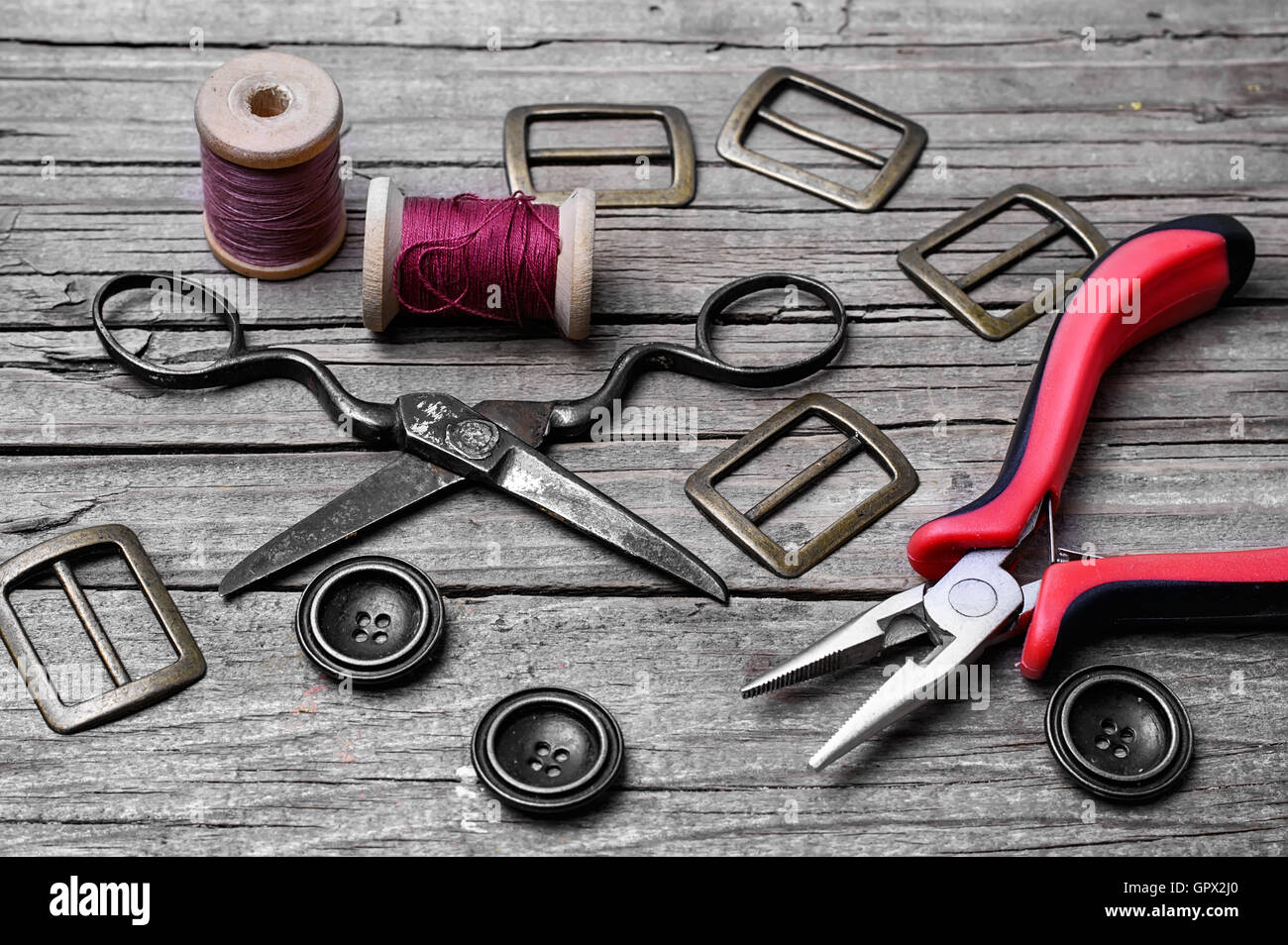 Buttons and fasteners from outdated clothes on wooden background Stock ...