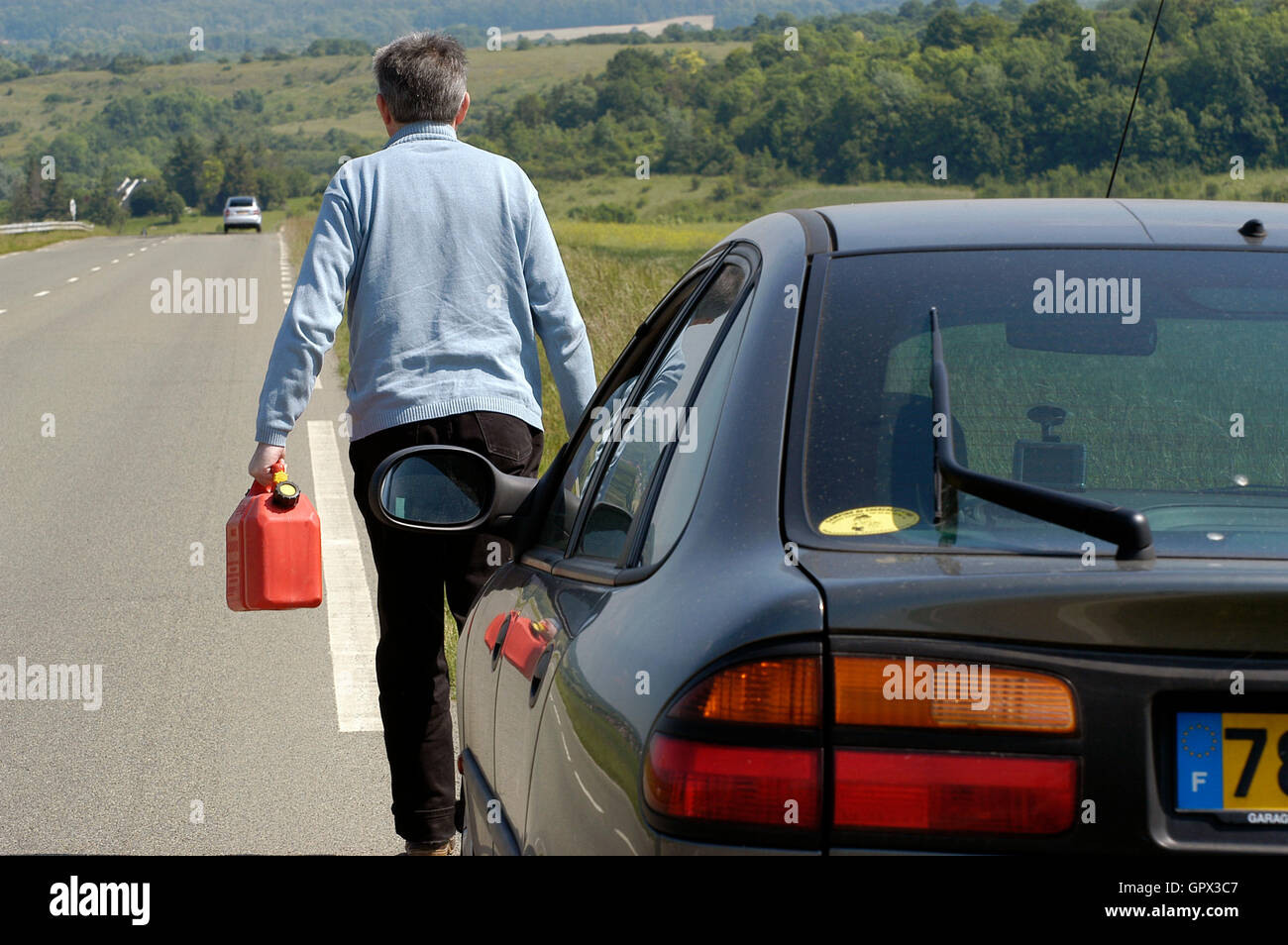 Running out on a country road Stock Photo - Alamy