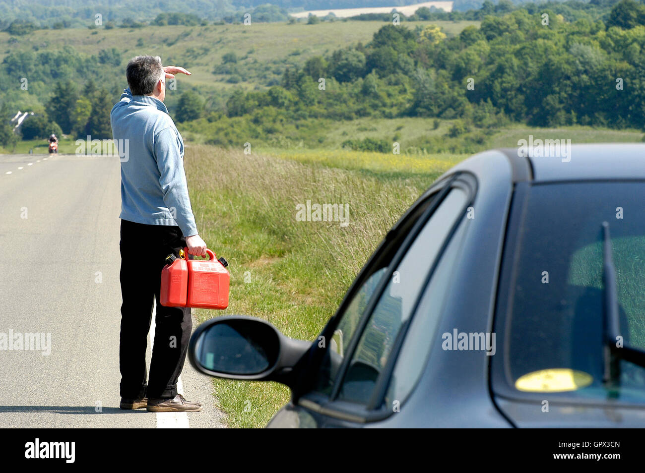 Running out on a country road Stock Photo - Alamy