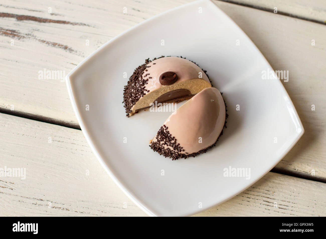 Small cake with brown filling Stock Photo - Alamy