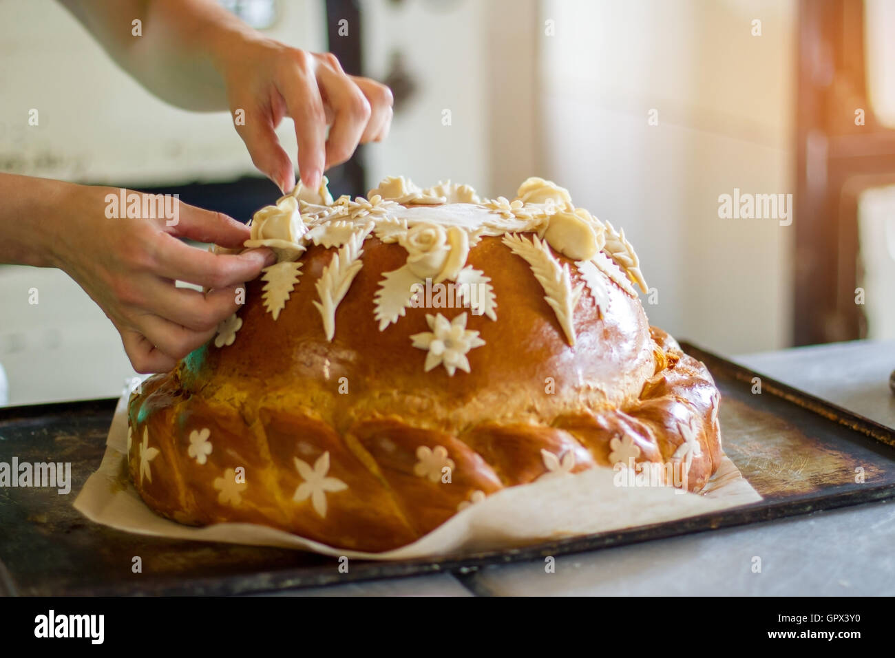 Woman's hands touch decorated bread Stock Photo - Alamy