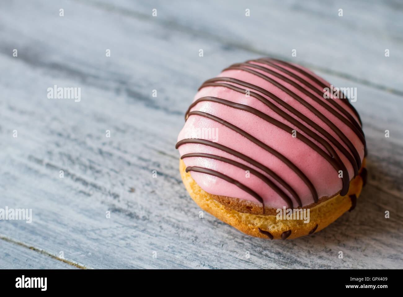 Biscuit with pink icing Stock Photo - Alamy