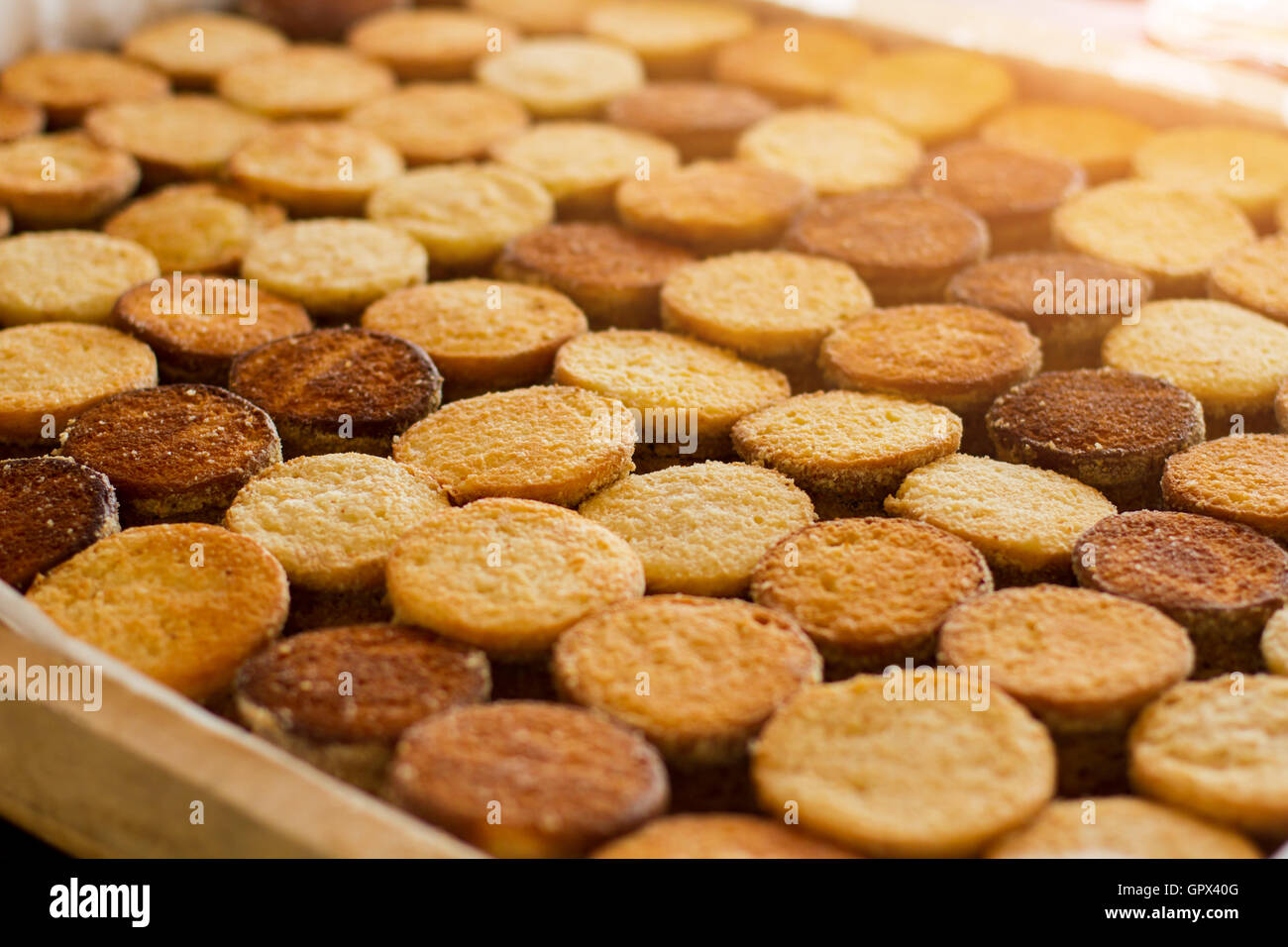 Rows of yellow cookies Stock Photo - Alamy