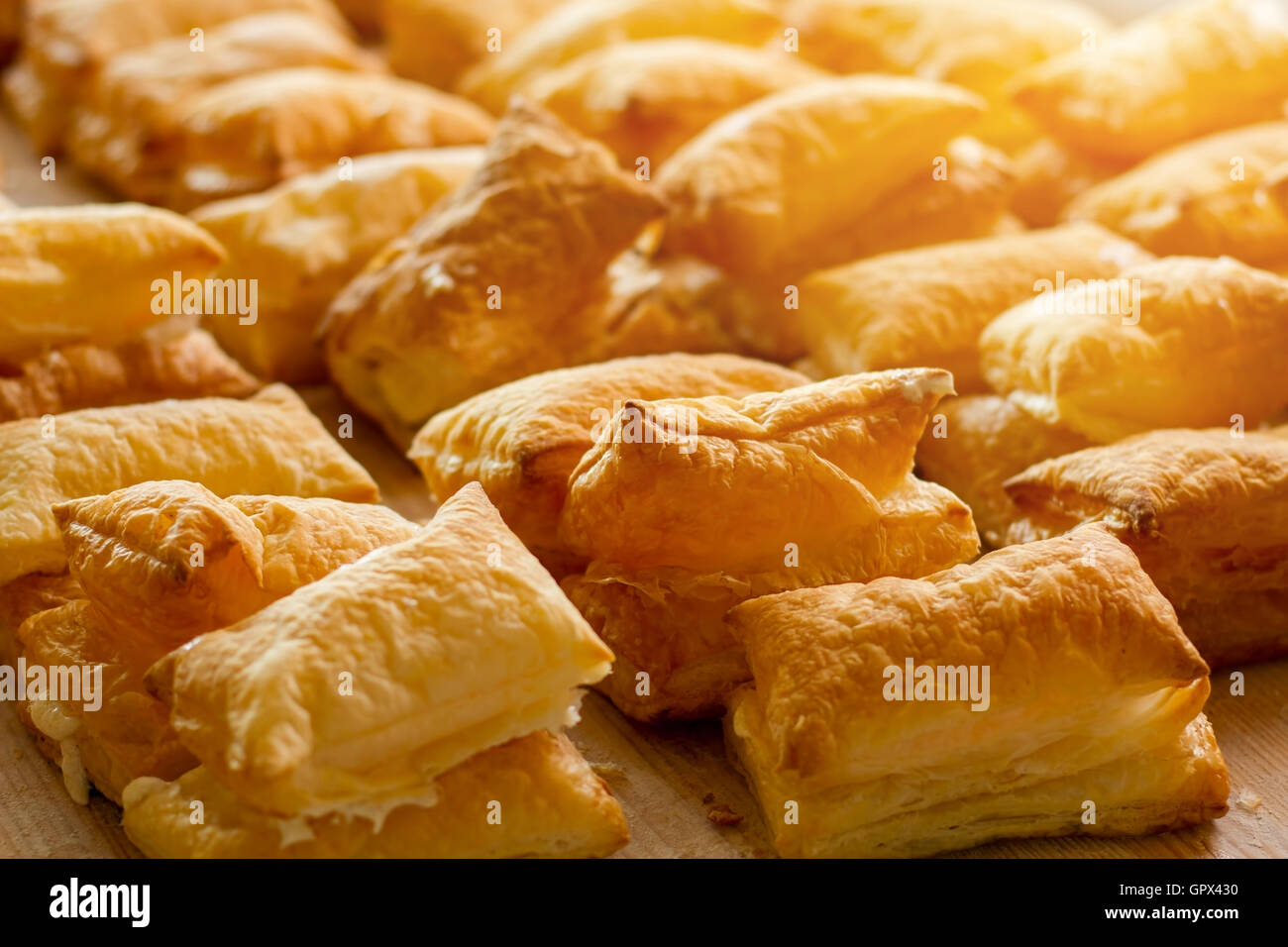 Puffs on light wooden board Stock Photo - Alamy